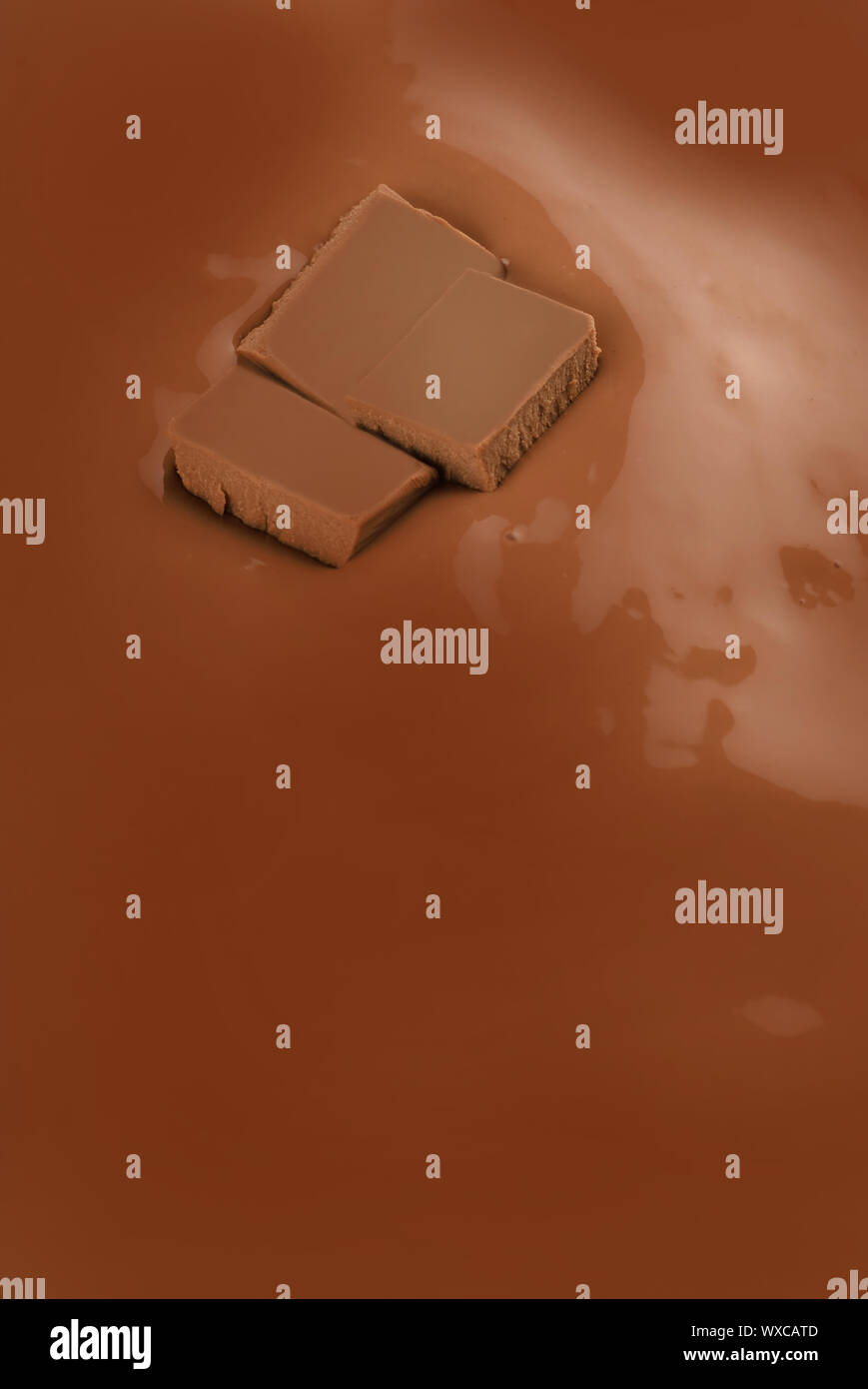 Chocolate floating and melting in dessert sauce Stock Photo - Alamy