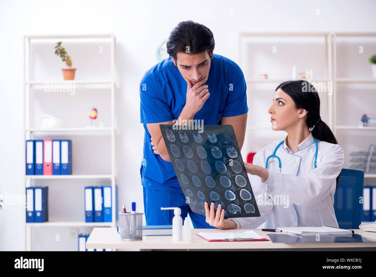 Two young doctors working in the clinic Stock Photo - Alamy