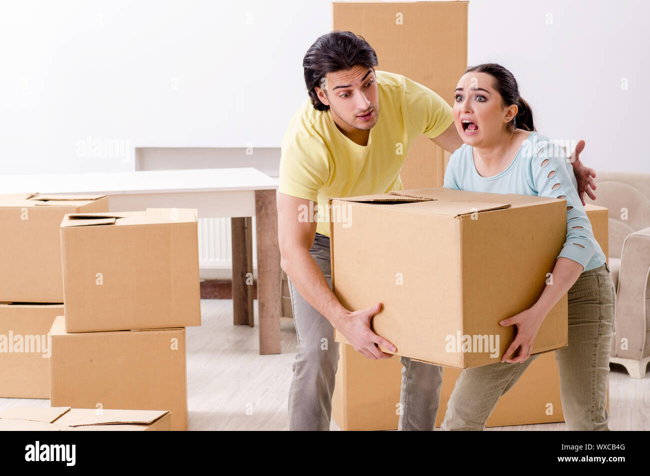 Delivery man falling stack boxes hi-res stock photography and images ...