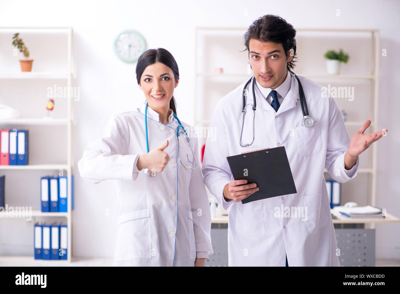 Two young doctors working in the clinic Stock Photo - Alamy