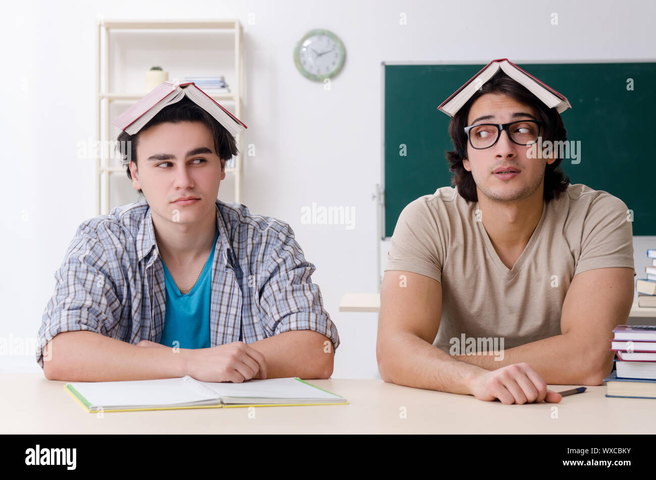 Two male students in the classroom Stock Photo - Alamy