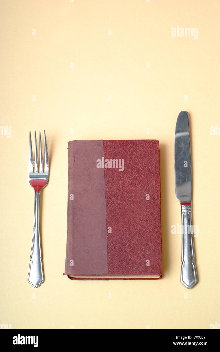 Learn by eating knowledge in book with knife and fork concept Stock ...