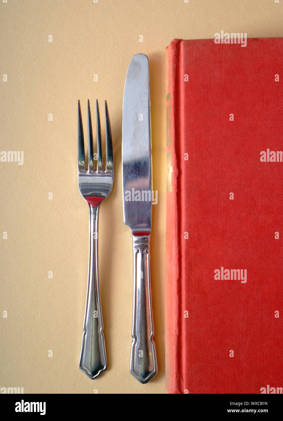 Learn by eating knowledge in book with knife and fork concept Stock ...