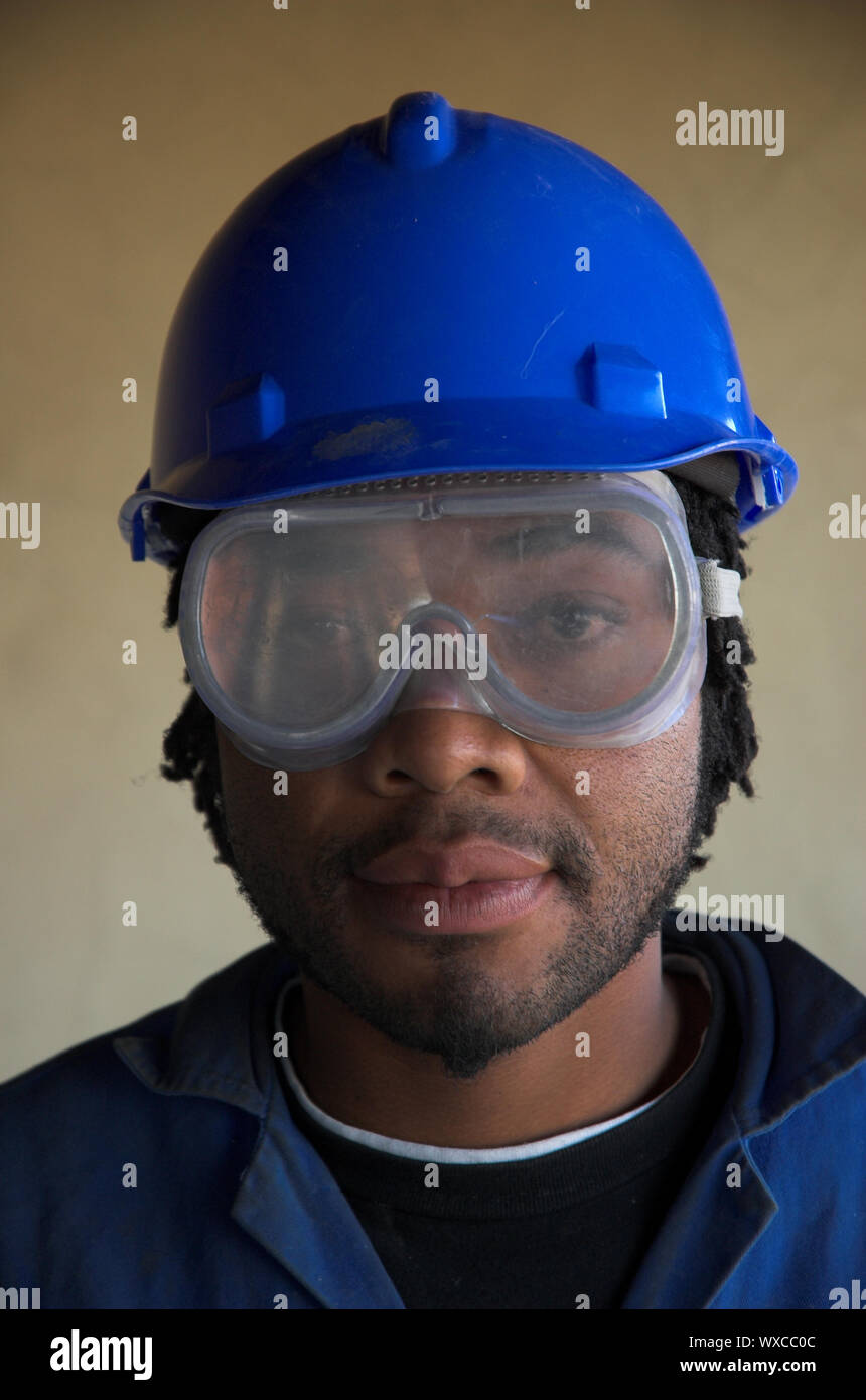 Construction worker and eye face mask Stock Photo - Alamy