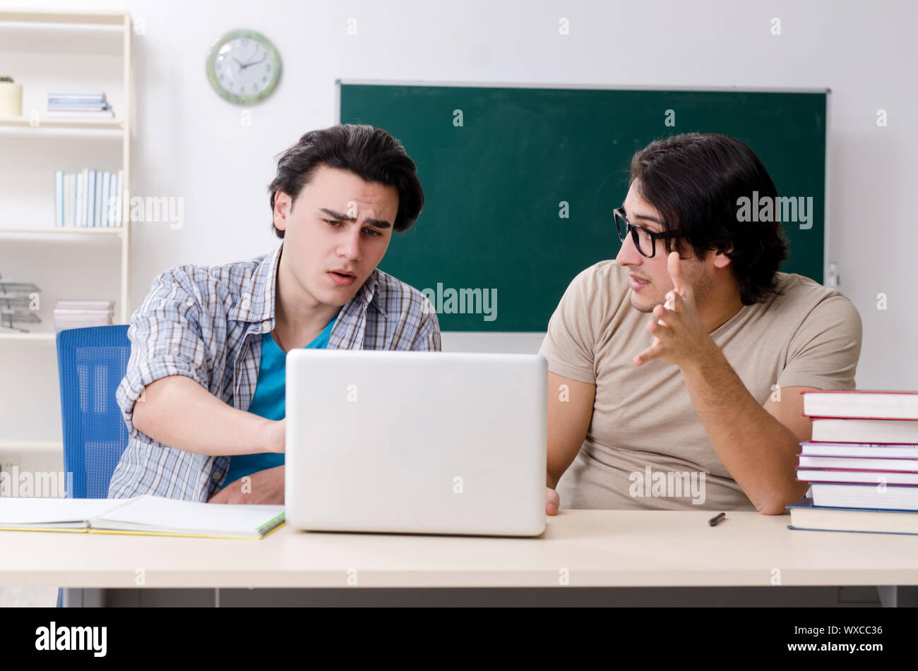 Two male students in the classroom Stock Photo - Alamy