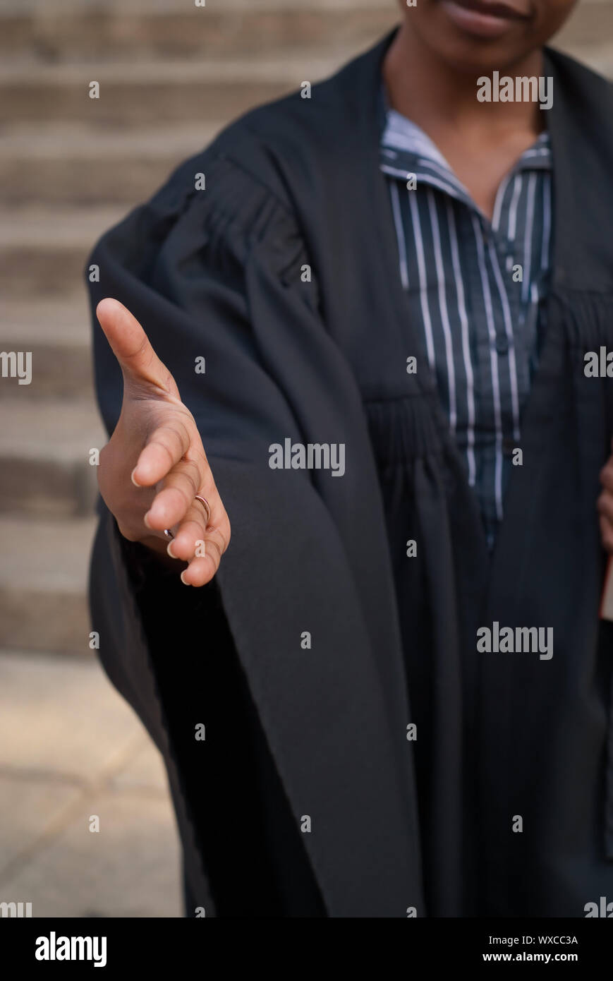 African American female woman lawyer shaking hands outside court house ...