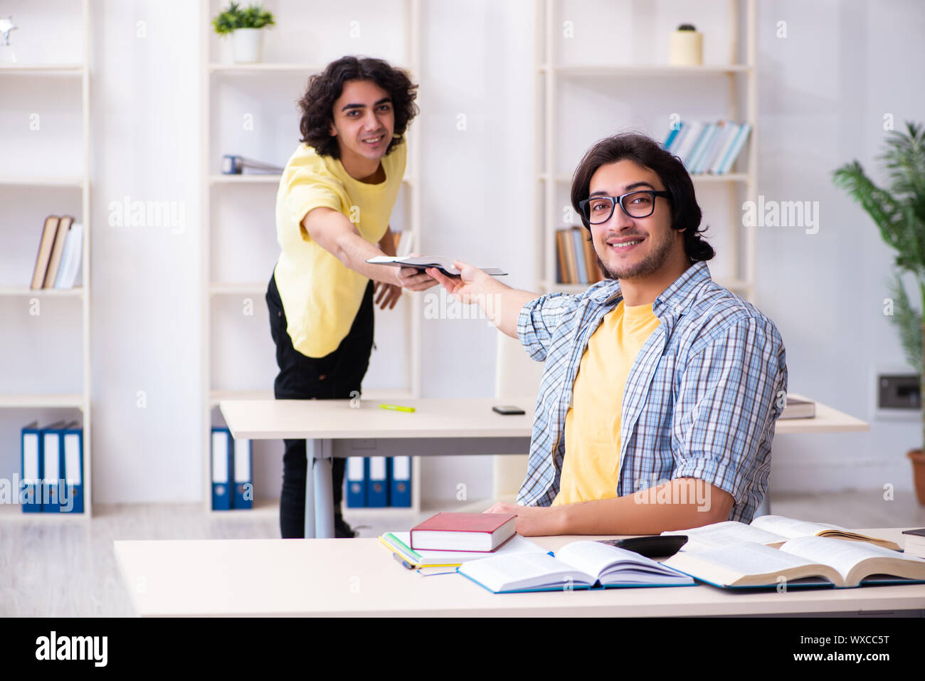 Two male students in the classroom Stock Photo - Alamy