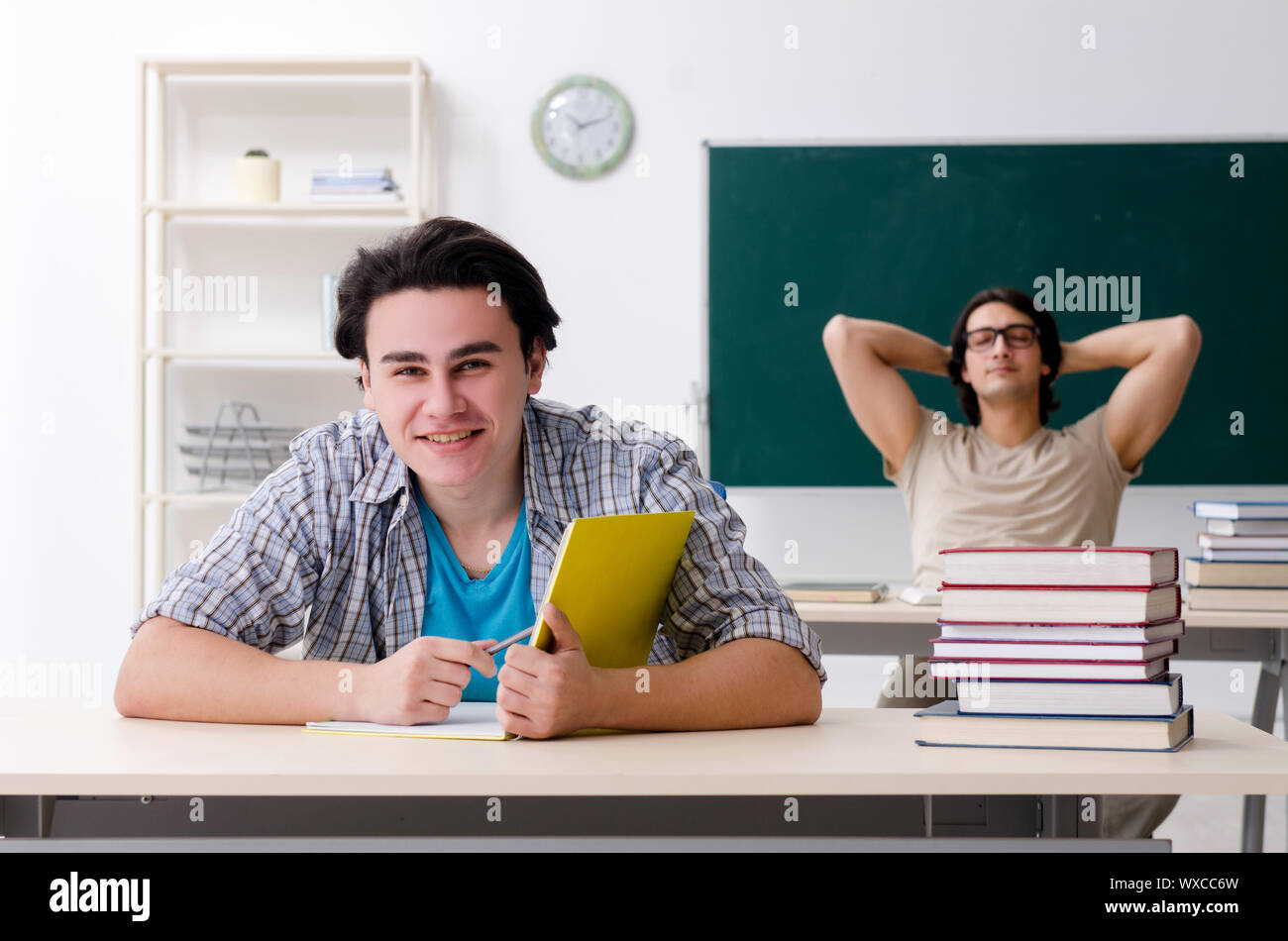 Two male students in the classroom Stock Photo - Alamy
