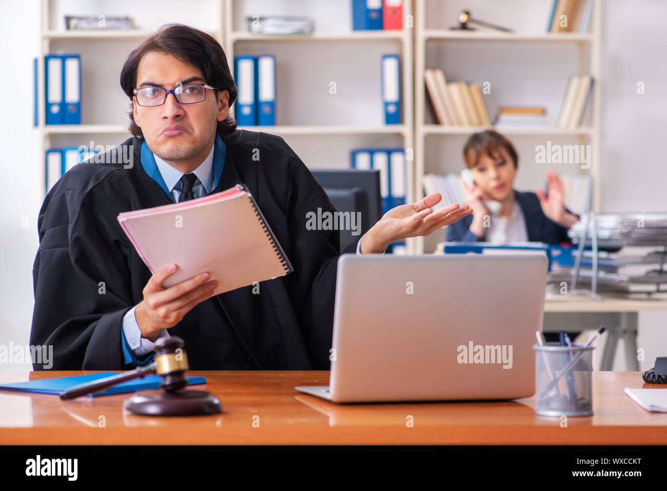 Two lawyers working in the office Stock Photo - Alamy