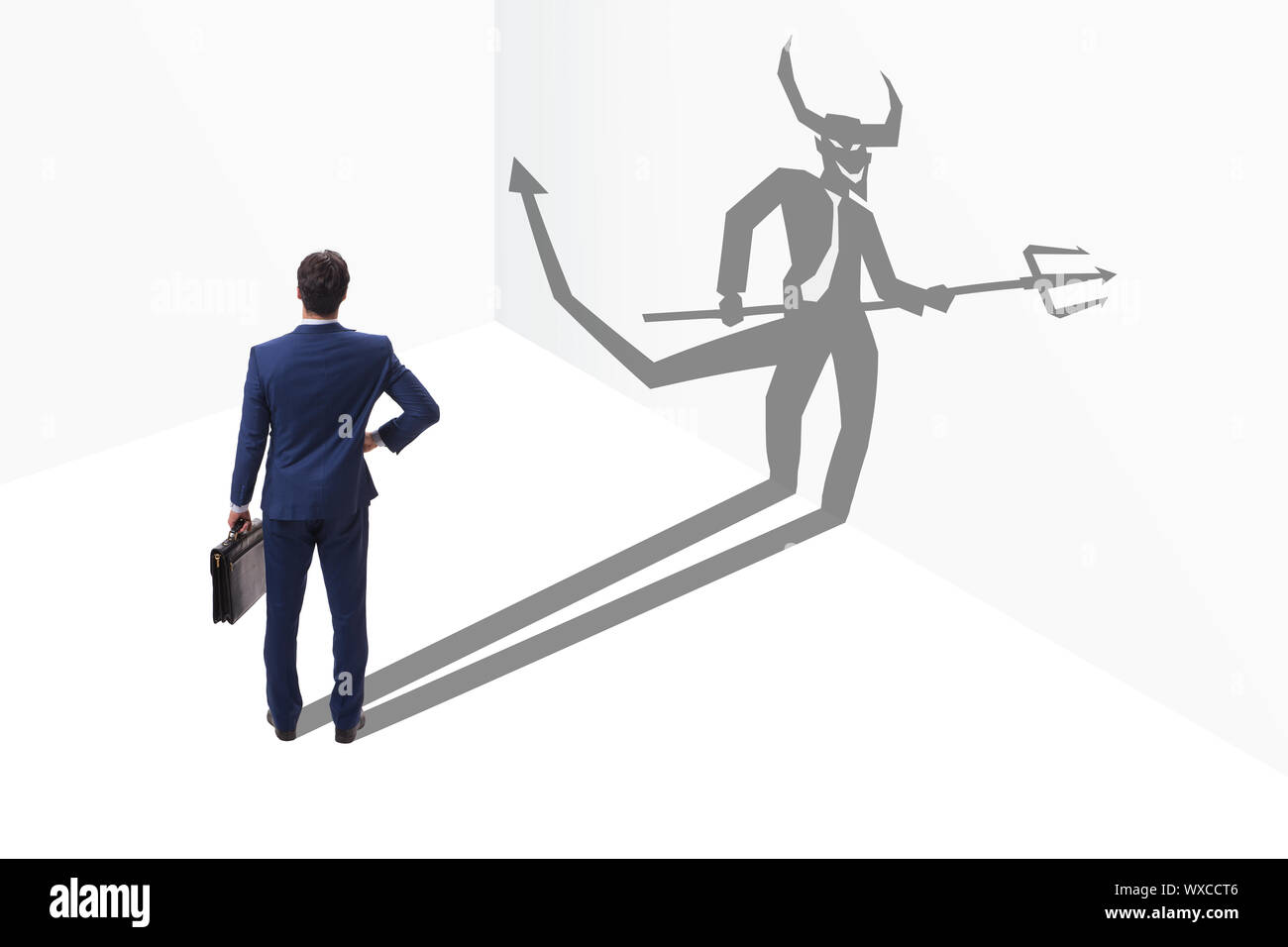 Devil hiding in the businessman - alter ego concept Stock Photo - Alamy