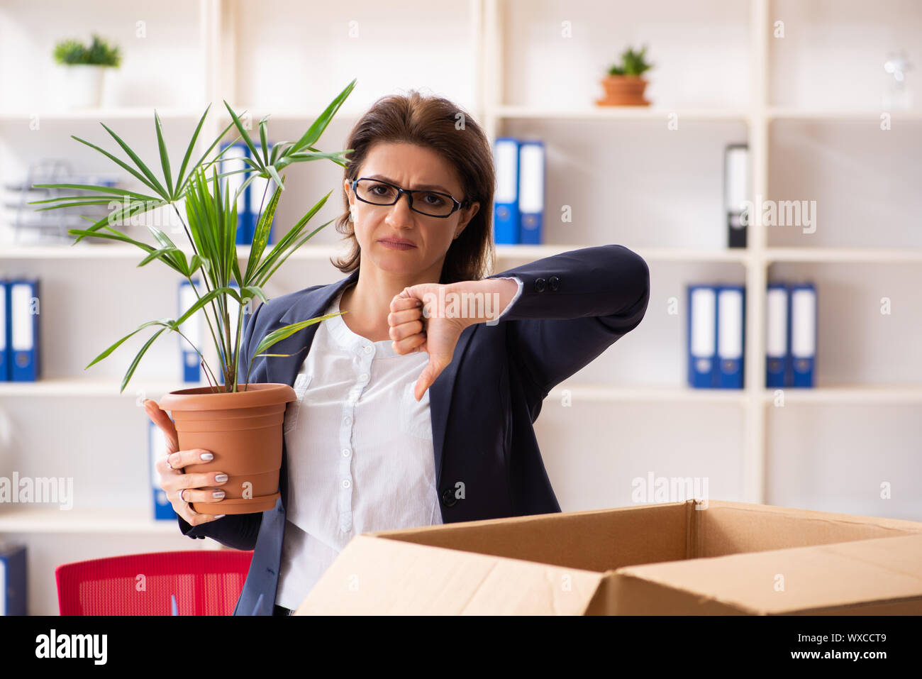 Middle-aged female employee being fired from her work Stock Photo - Alamy