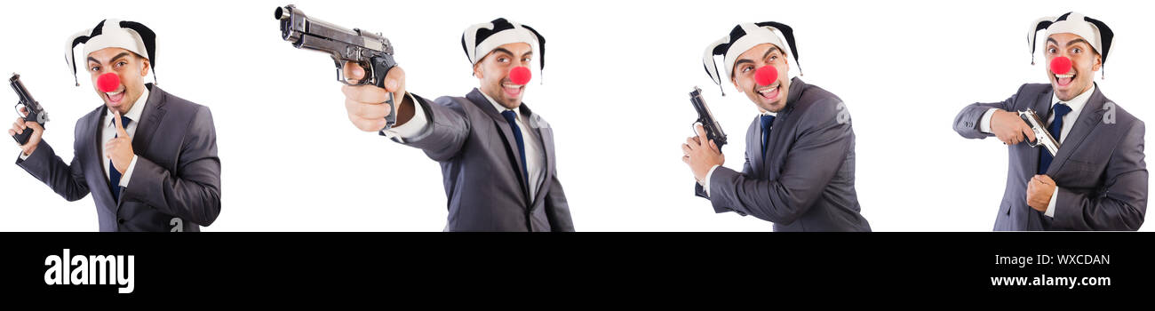Funny clown businessman with handgun Stock Photo - Alamy