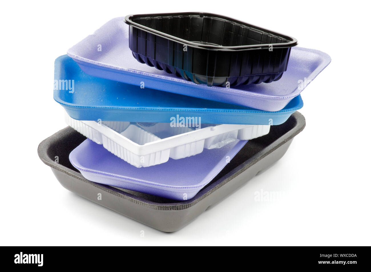 Stack of Colored Empty Recycled Trays closeup on white background Stock ...