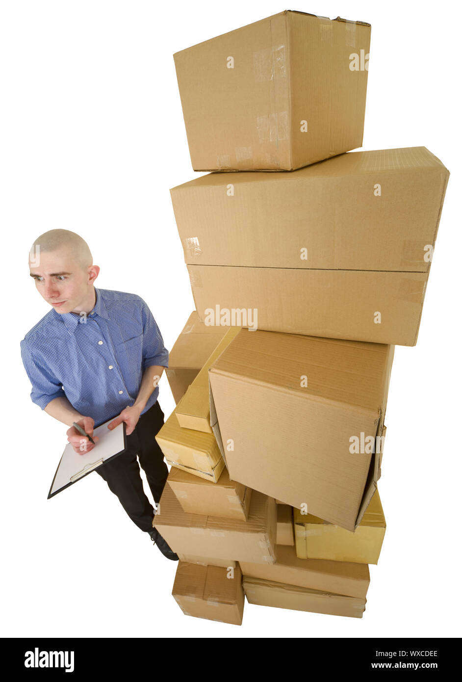 Courier and pile cardboard boxes and tablet Stock Photo - Alamy
