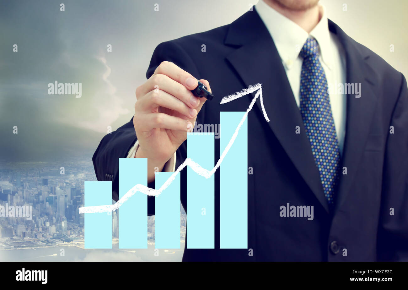Business man with a chart showing growth with city background Stock ...