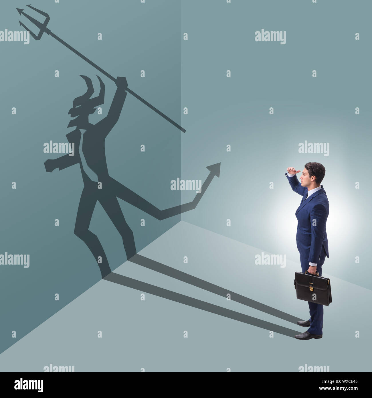 Devil hiding in the businessman - alter ego concept Stock Photo - Alamy