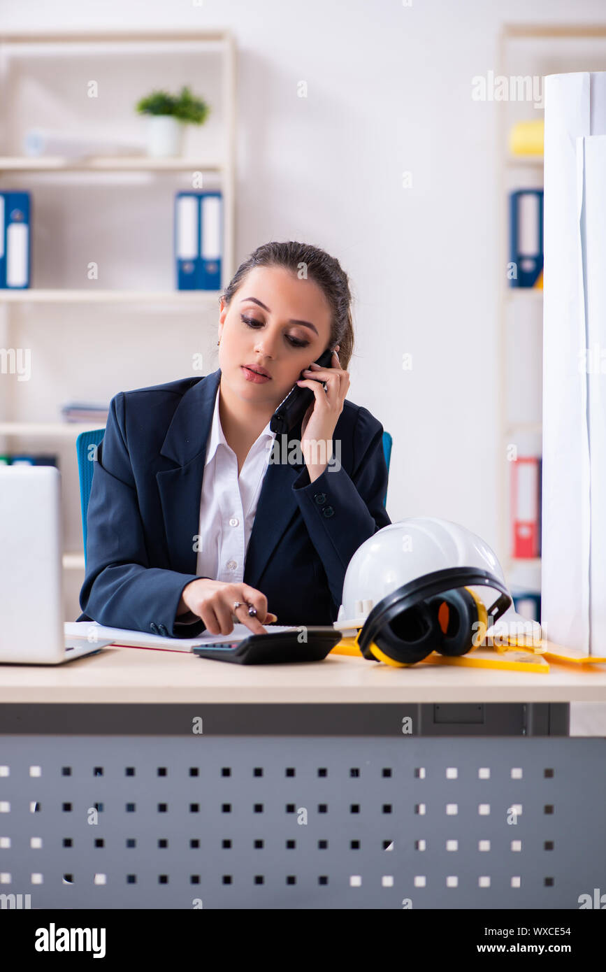 Young female architect working in the office Stock Photo - Alamy