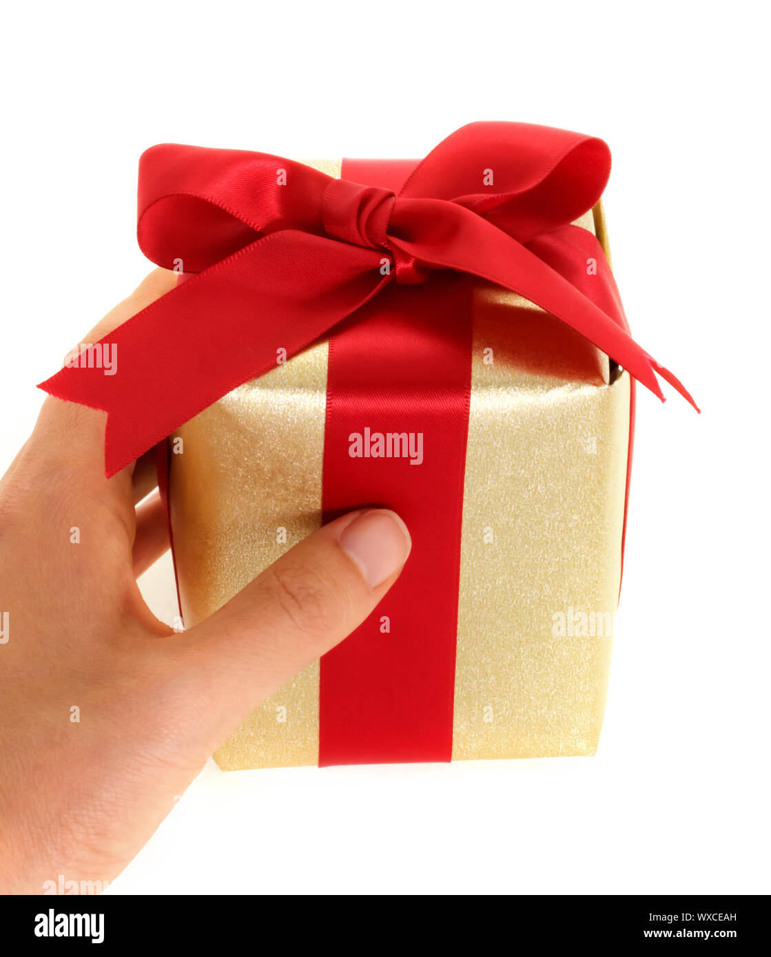 Hand holding gift box on white background Stock Photo - Alamy