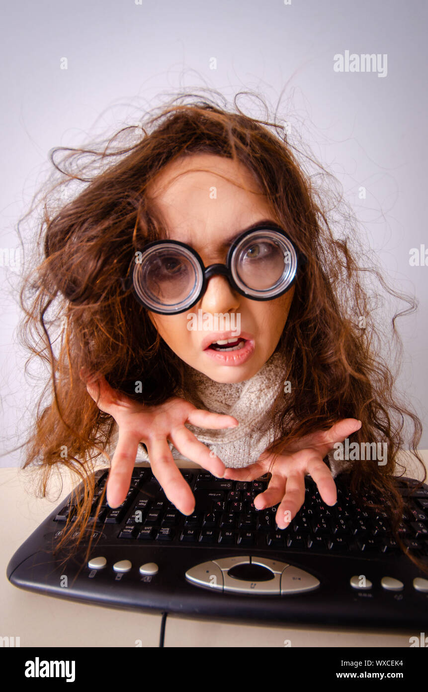 Funny nerd girl working on computer Stock Photo - Alamy
