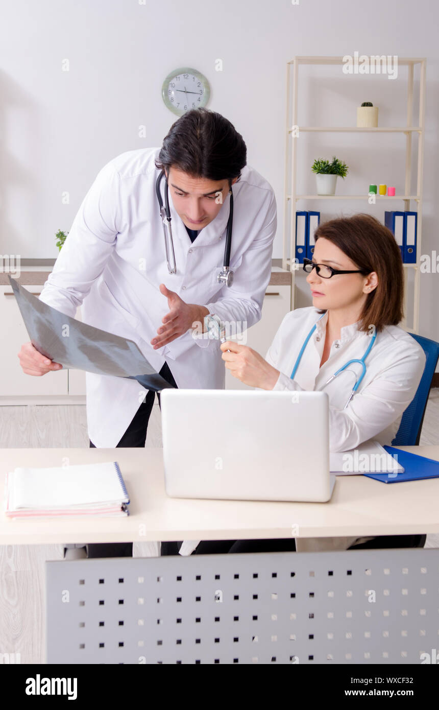 Two doctors working in the clinic Stock Photo - Alamy