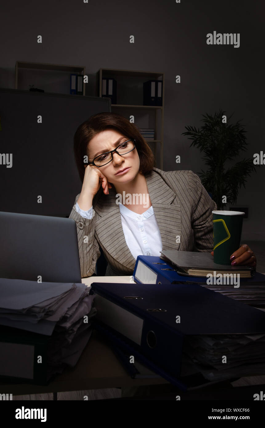 Female employee suffering from excessive work Stock Photo - Alamy