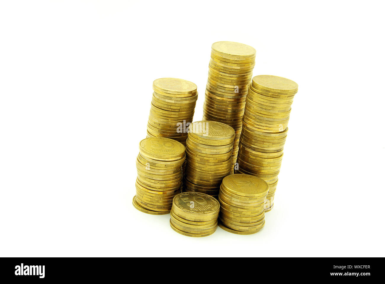 Coin pile isolated on white background Stock Photo - Alamy