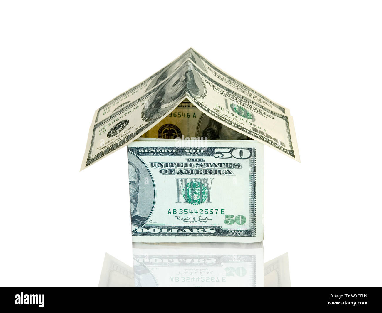 Money house on white background Stock Photo - Alamy