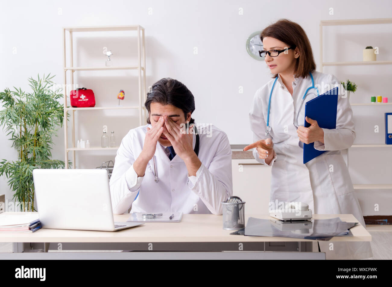 Two doctors working in the clinic Stock Photo - Alamy