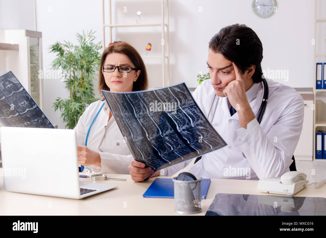 Two doctors working in the clinic Stock Photo - Alamy