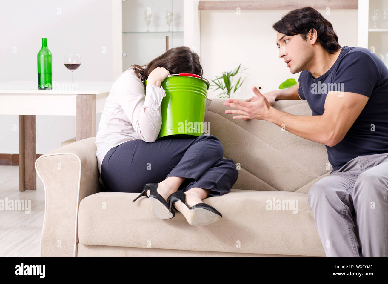 Young wife suffering from sick stomach and vomiting Stock Photo - Alamy