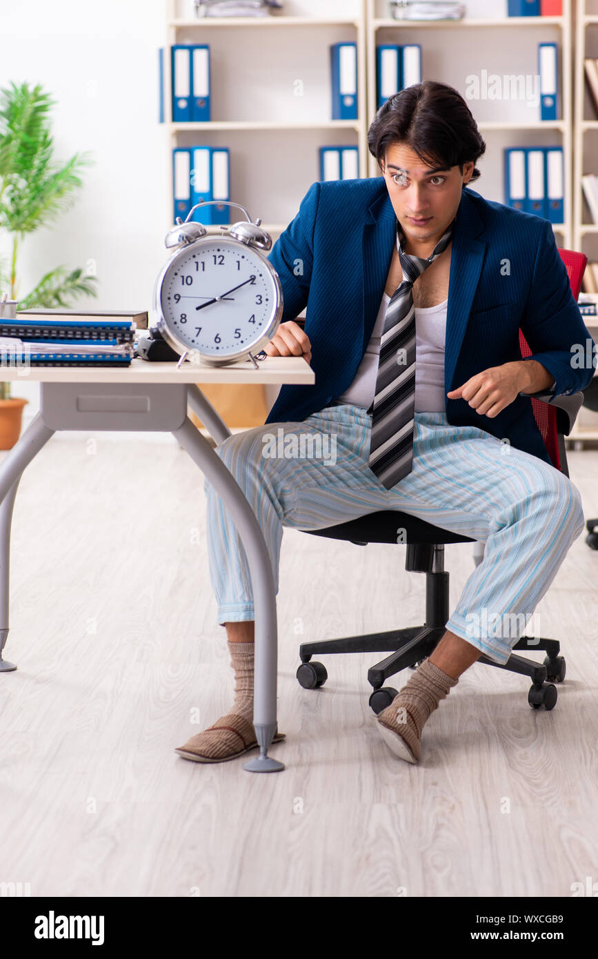 Employee coming to work straight from bed Stock Photo - Alamy