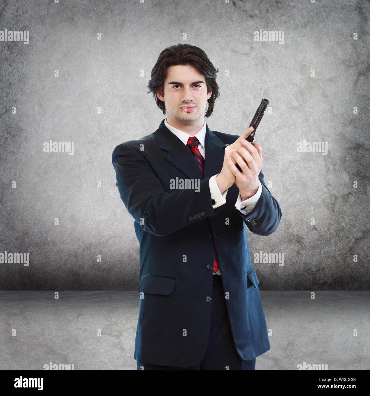 Handsome Man with a Hand Gun (agent, assassin, etc Stock Photo - Alamy