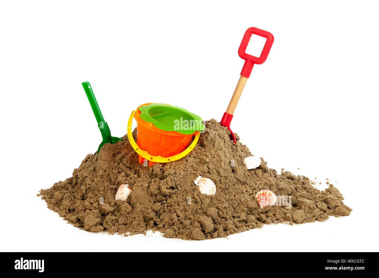 heap sand with plastic toys at the beach isolated over white background ...