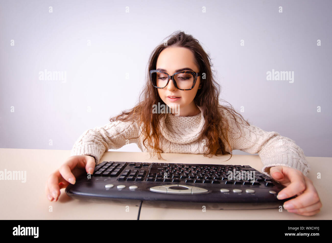 Funny nerd girl working on computer Stock Photo - Alamy