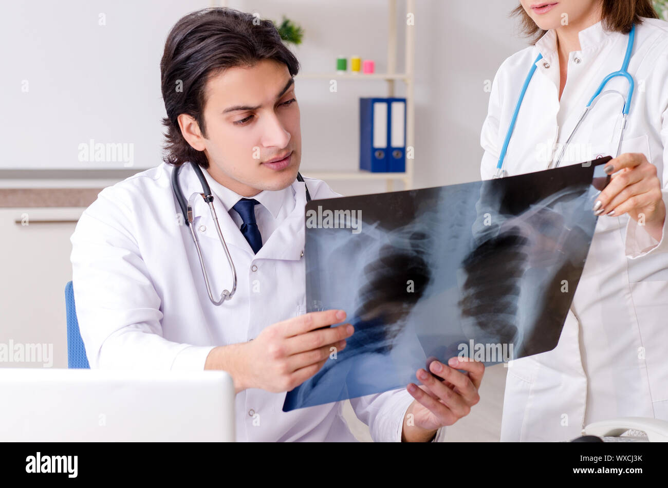 Two doctors working in the clinic Stock Photo - Alamy