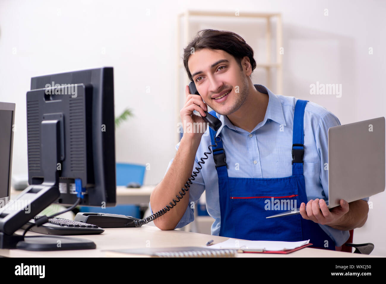 Male it specialist working in the office Stock Photo - Alamy