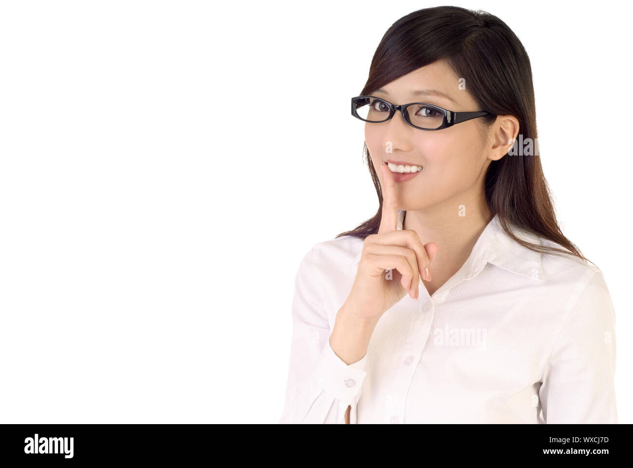 Silent gesture by businesswoman with smile on white background Stock ...