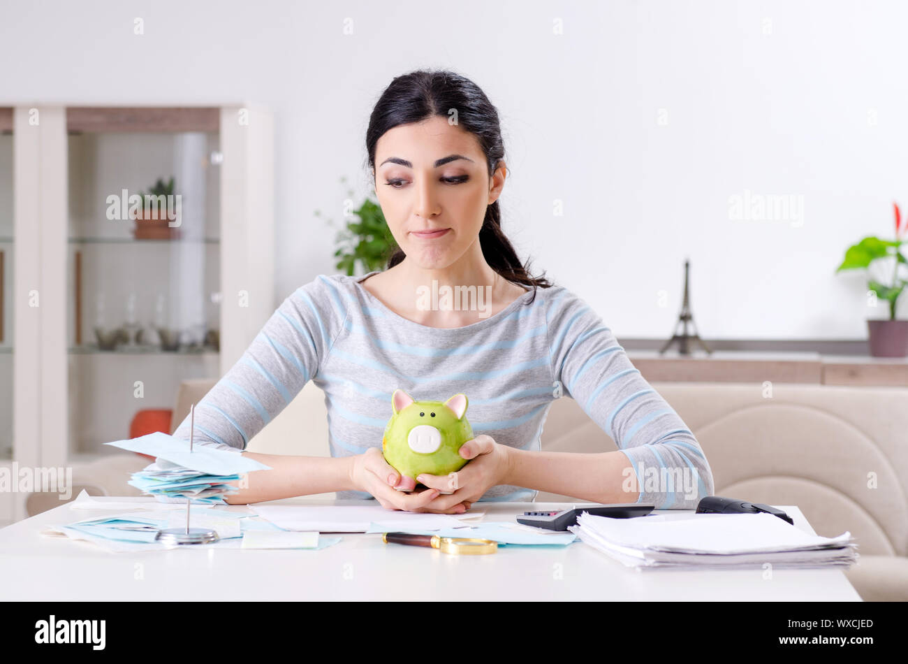 Young woman in budget planning concept Stock Photo - Alamy