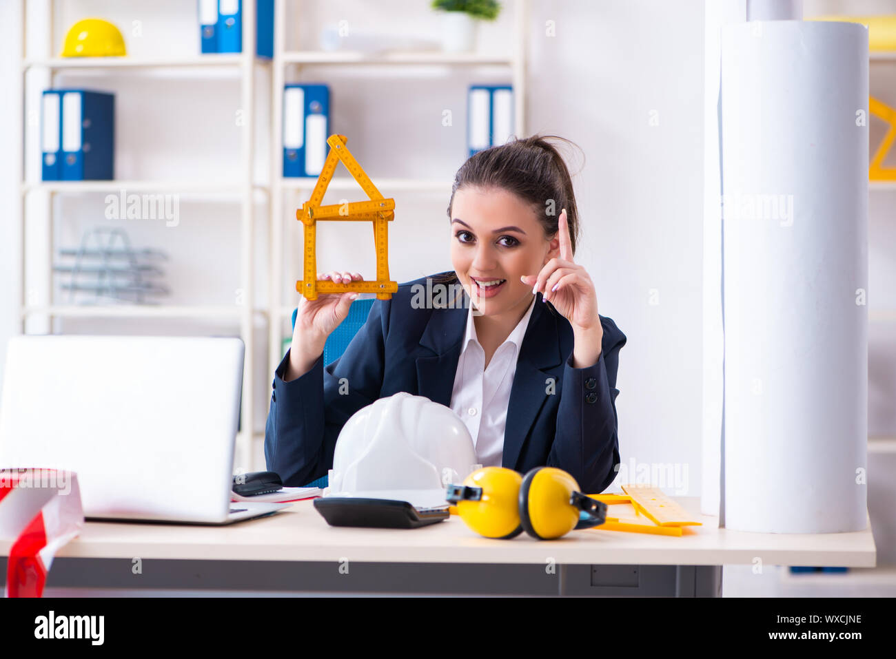 Young female architect working in the office Stock Photo - Alamy