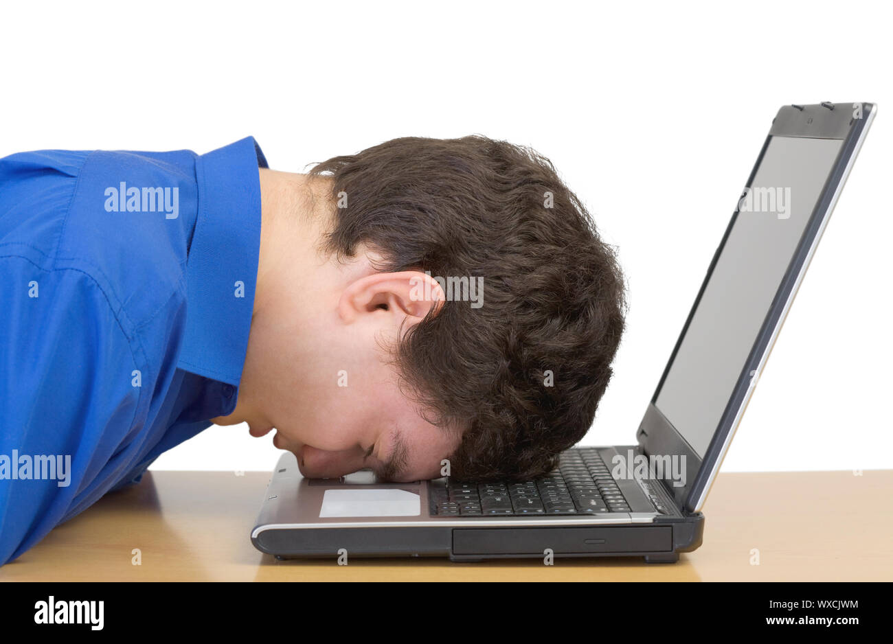 A man in despair buried his head in the computer keyboard Stock Photo ...