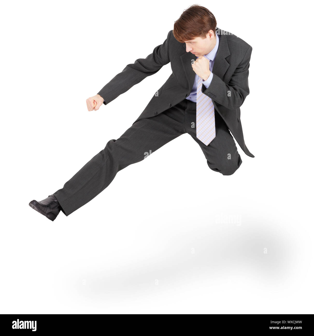 Fighting businessman kicked in the jump, isolated on a white background ...