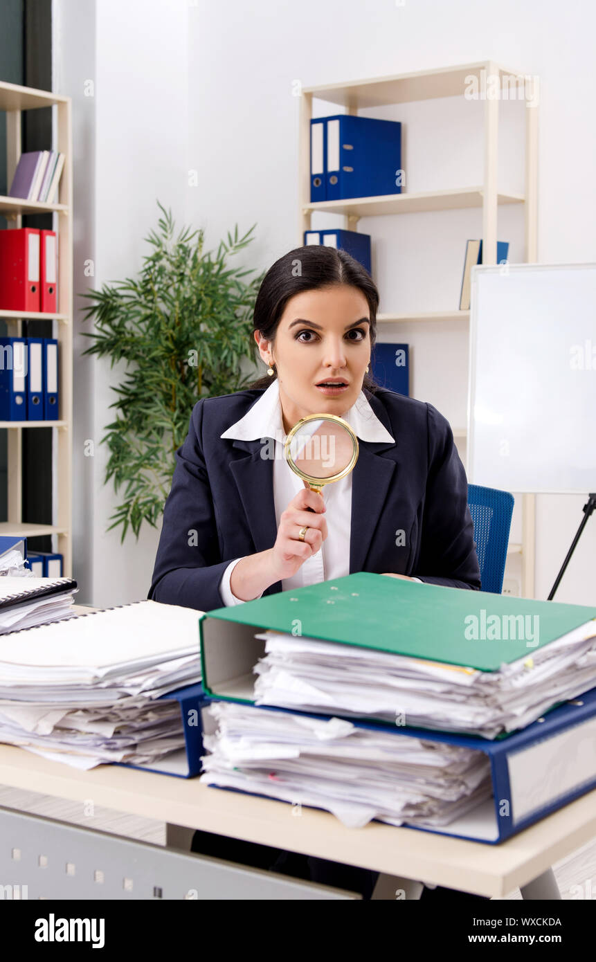 Female employee with too much work in the office Stock Photo - Alamy