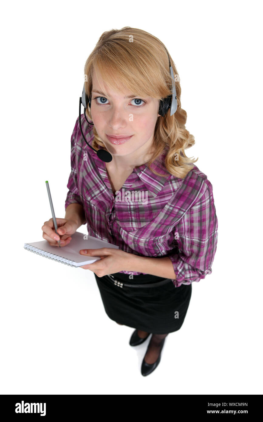 secretary wearing headset taking notes Stock Photo - Alamy