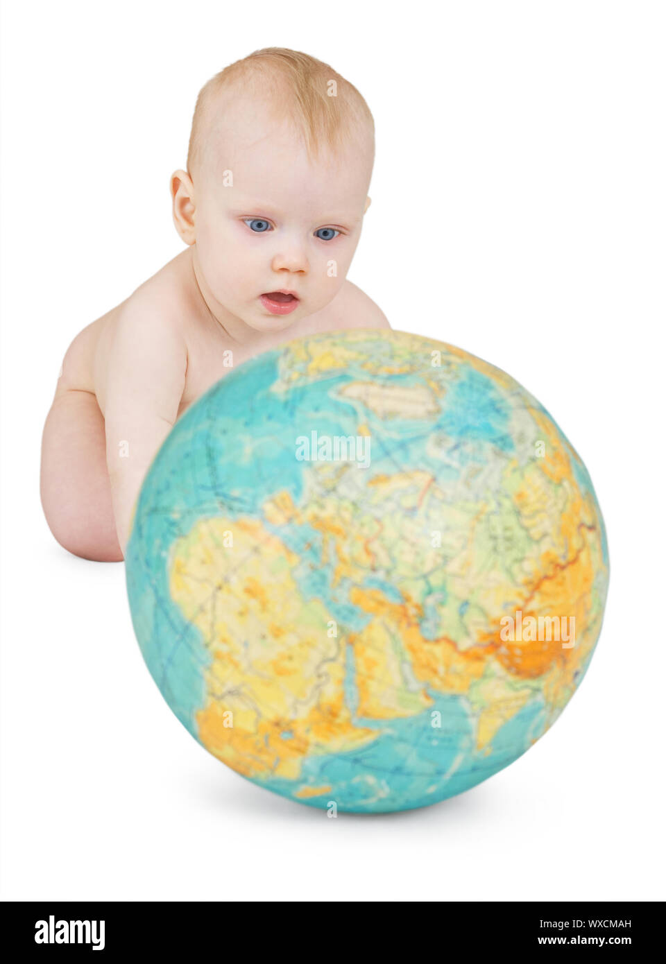 A baby playing with a globe of earth, isolated on a white background ...