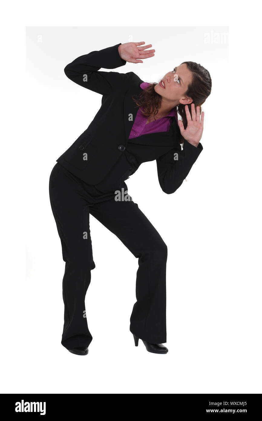 A businesswoman afraid of something falling from the ceiling Stock ...