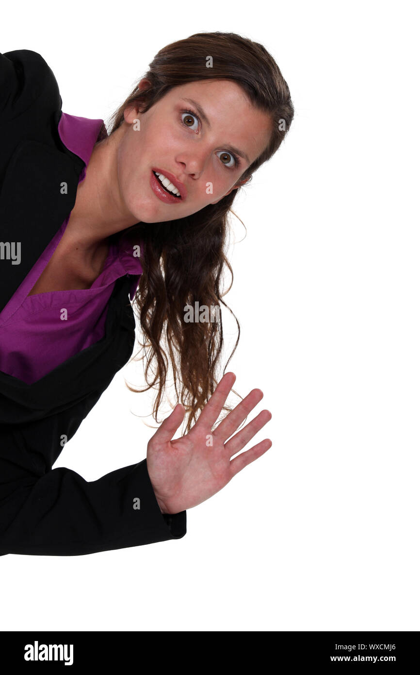 Shocked businesswoman waving hand Stock Photo - Alamy