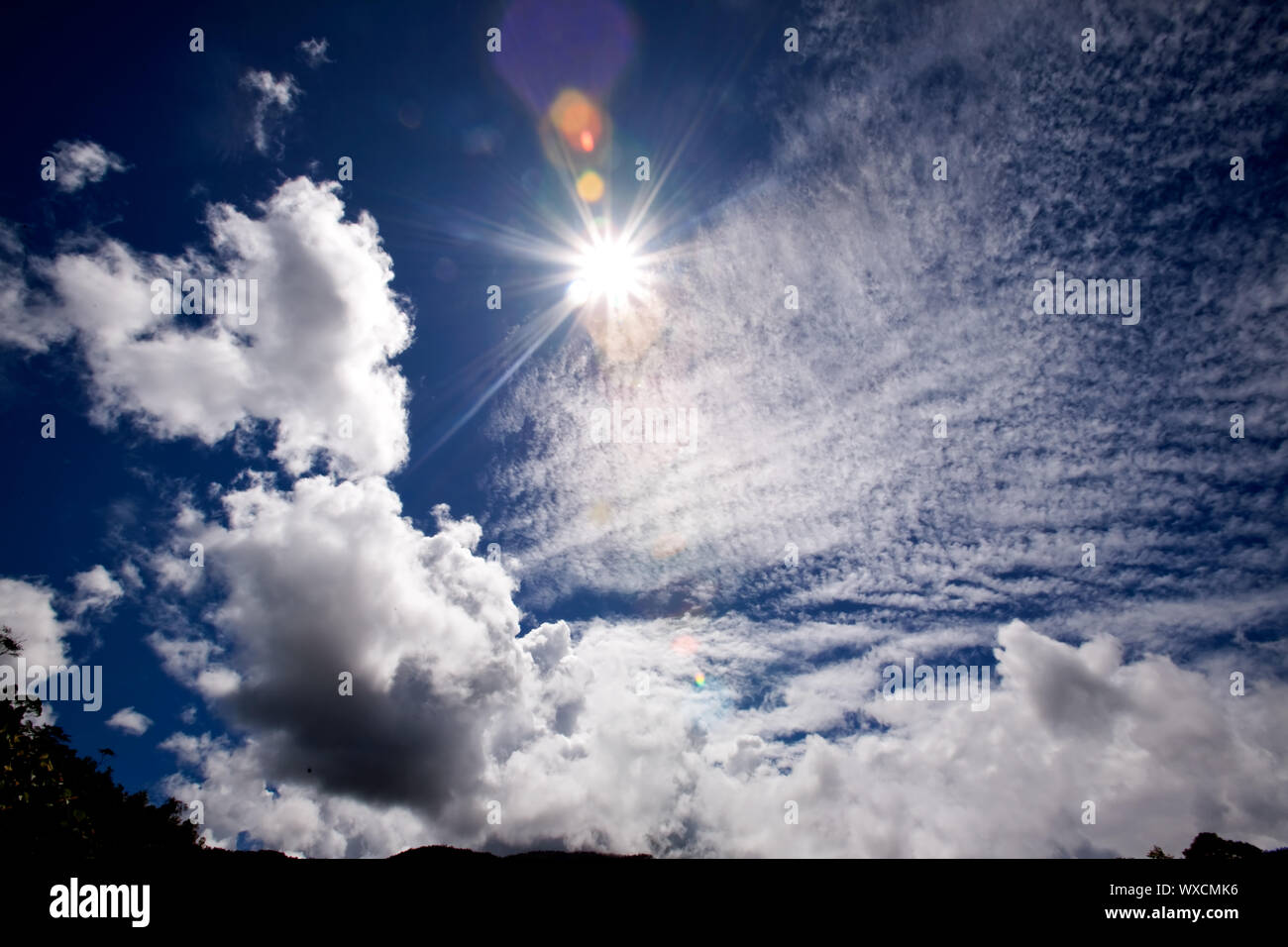 Cloud blue sunburst hi-res stock photography and images - Alamy