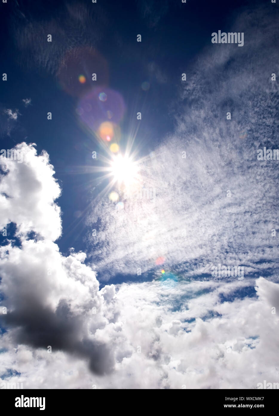 The sun in a blue sky Stock Photo - Alamy
