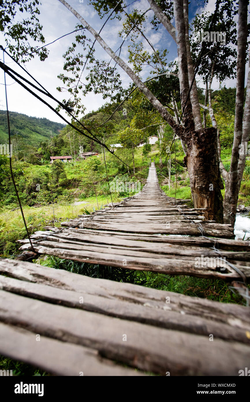 Rope bridge and mountain and river hi-res stock photography and images ...