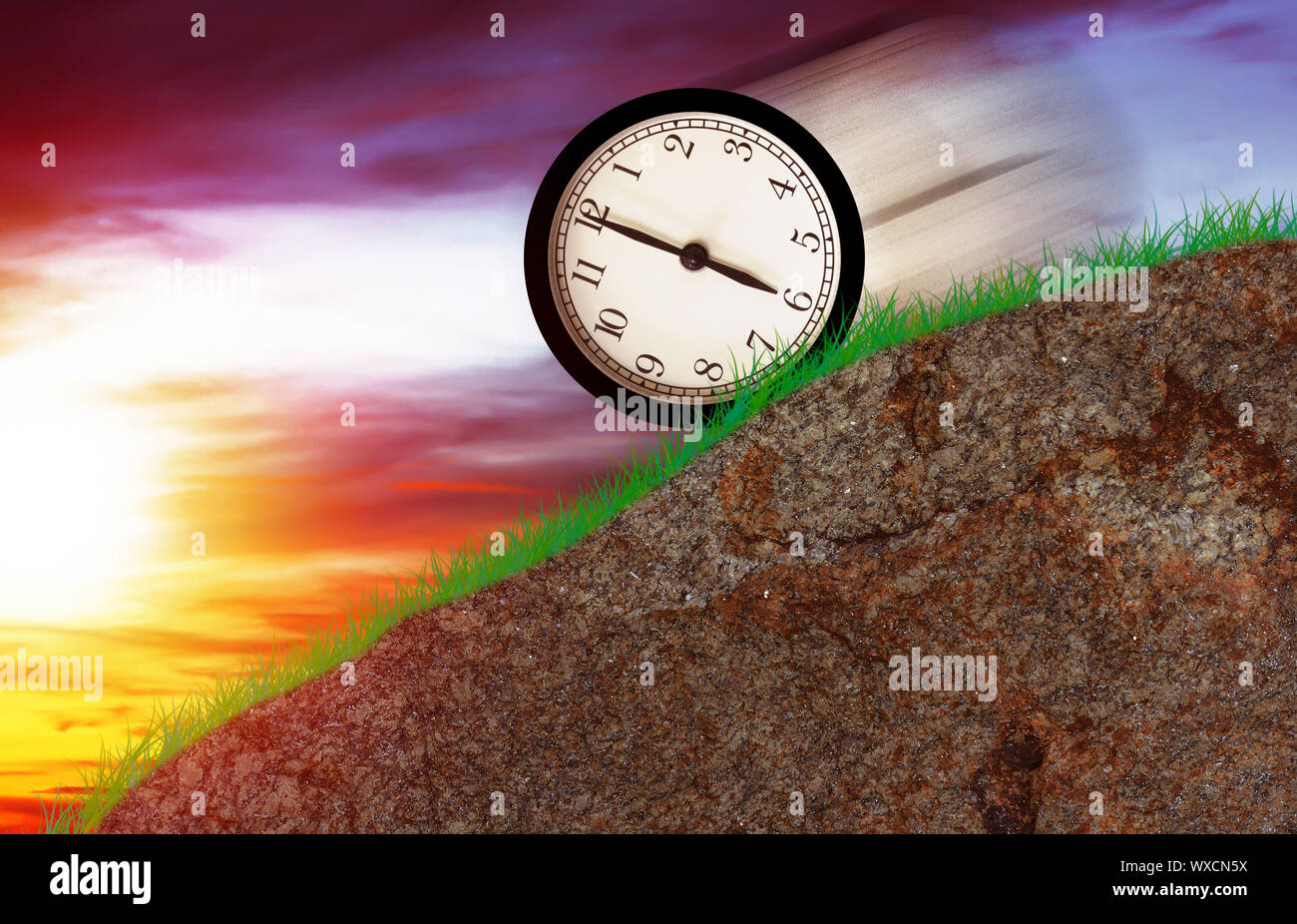 Time concept, clock moving down the hill Stock Photo - Alamy